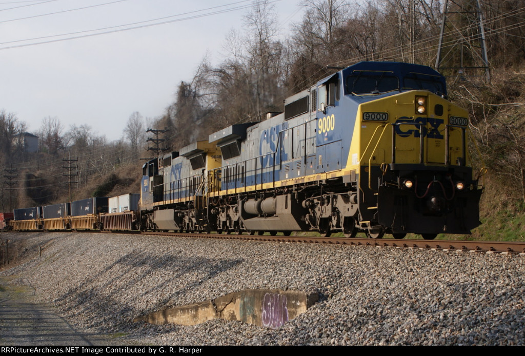 541 - CSXT 9000 leads Q13501 past the transformer yard.